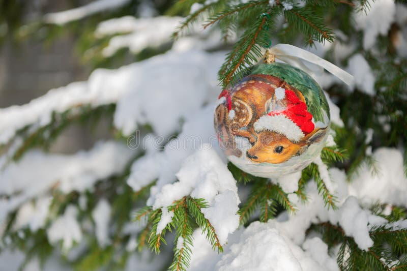 Christmas Bauble Hanging on a Christmas Tree Covered in Snow. Natural ...