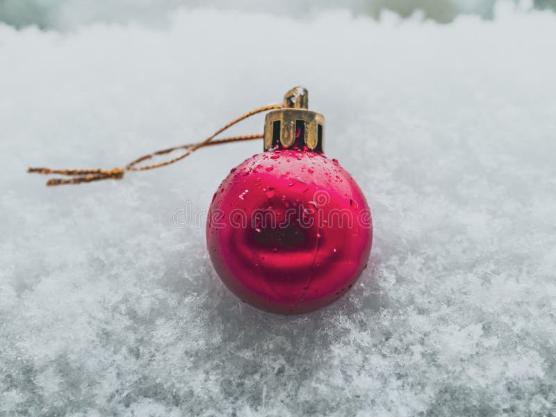 Christmas Bauble in the Snow, Single Red Bauble Stock Image - Image of ...
