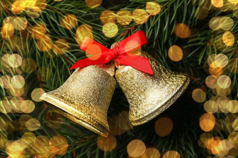 Christmas Bells with Red Bow on Fir Tree Branches, Flat Lay Stock Image ...