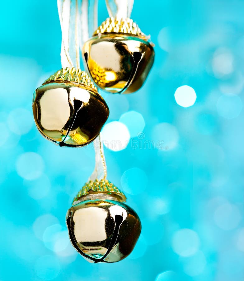 Christmas Jingle Bells in the Snow and Defocused Lights Stock Photo ...