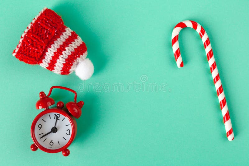 Christmas Candy Cane, Clock and Hat on Pastel Turquoise Backdrop with ...
