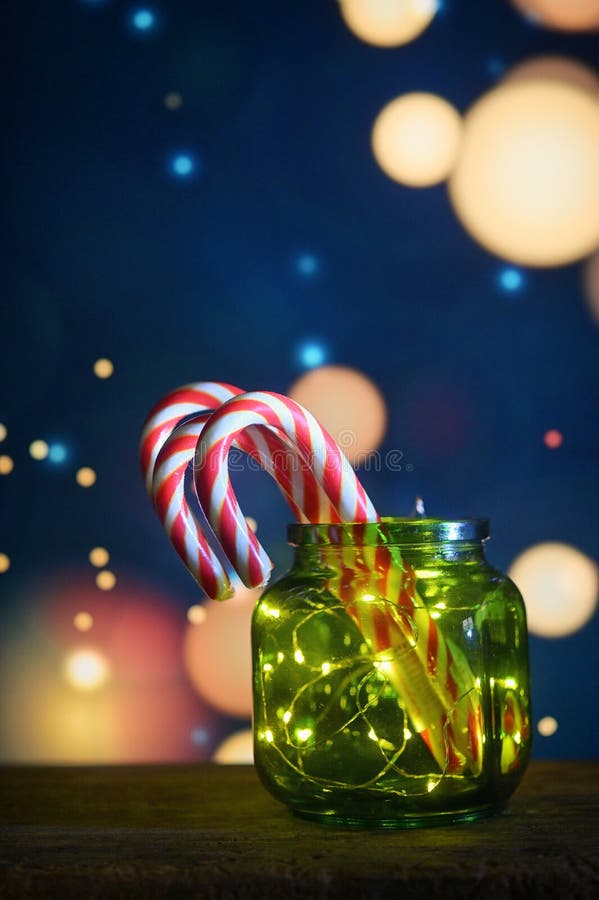 Christmas Candy Canes and Led Light Strips in Old Jar Stock Image ...