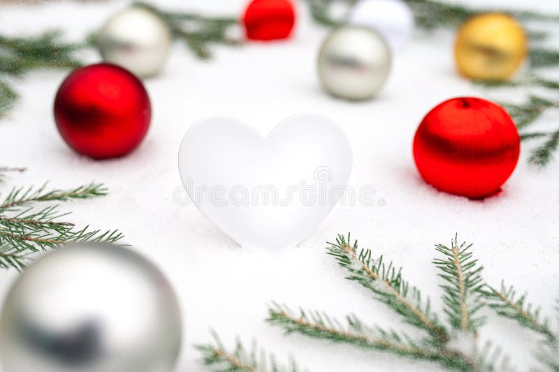 Christmas Composition with a Heart and Colored Balls in the Snow. Flat ...