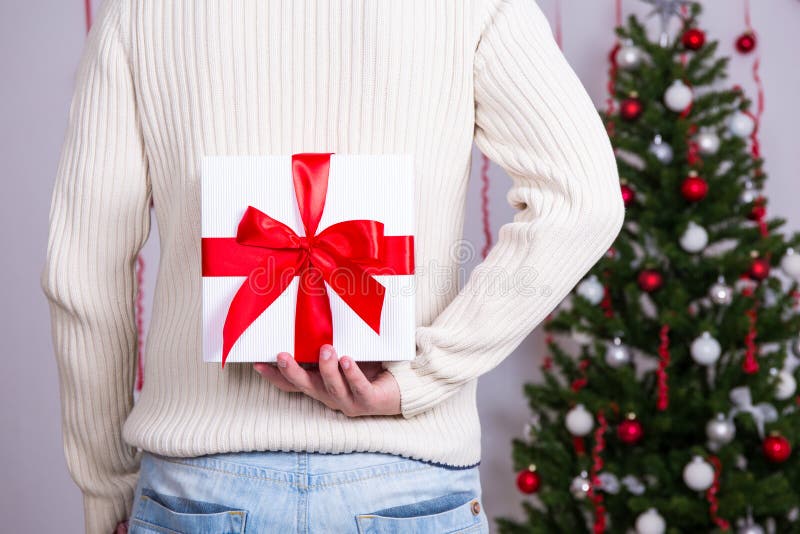 Christmas Concept - Man Hiding Gift Box Behind Back Stock Image - Image ...