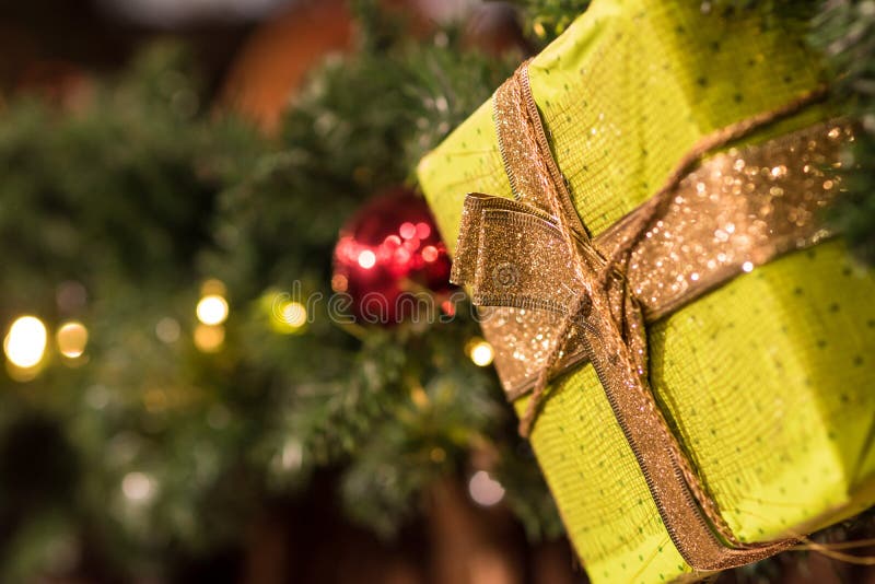 Green Present with Red Ribbon Over Snow Stock Photo - Image of modern ...