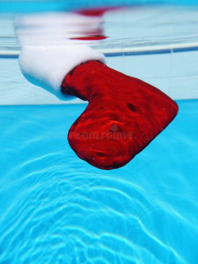 Christmas Decoration Sinking Down in the Water of a Pool Stock Image ...