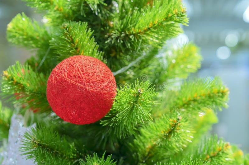 Christmas Decoration on the Tree in the Form of a Red Ball of Yarn ...