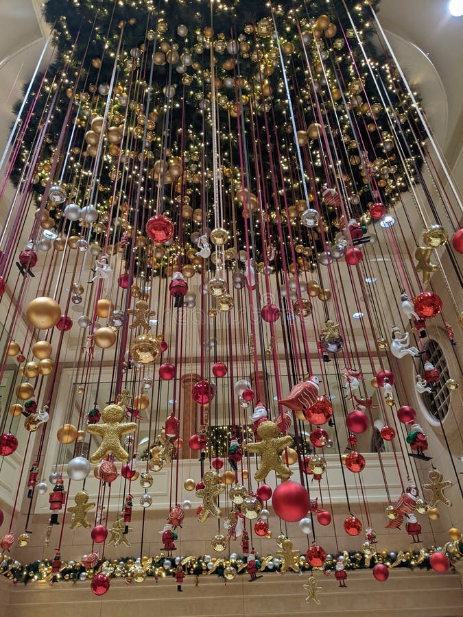 Christmas Decorations Falling from Ceiling Stock Image - Image of crowd ...