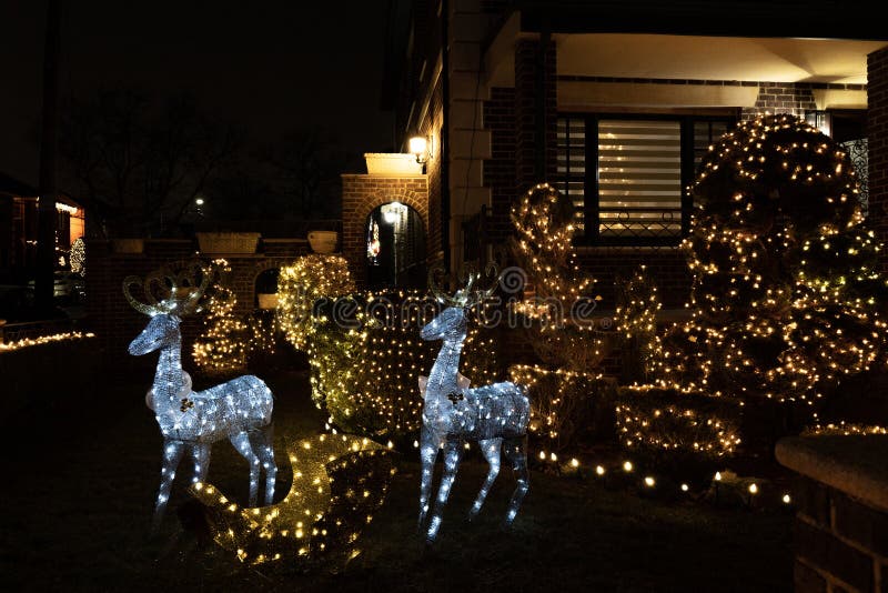 Christmas Decorations Glowing Outside at Night in Front of a House ...