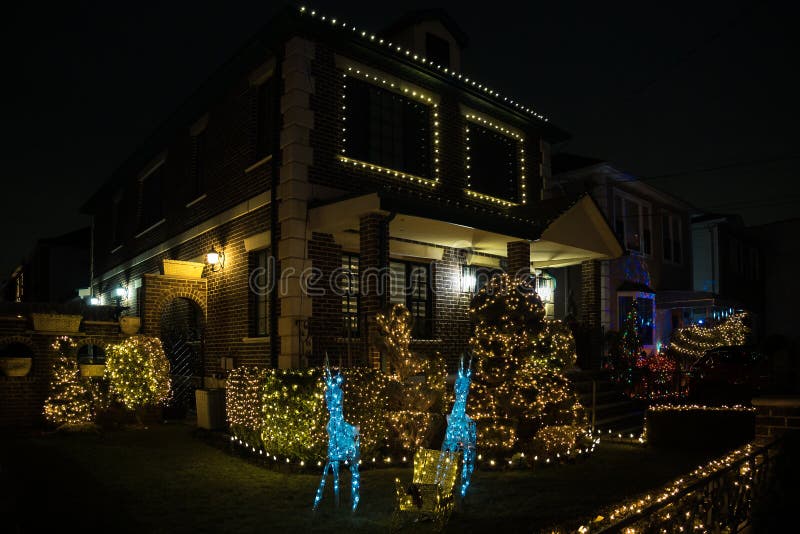Christmas Decorations Glowing Outside at Night in Front of a House ...
