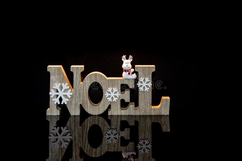 Christmas Decorations with the Word Noel in Wood. Stock Photo - Image ...