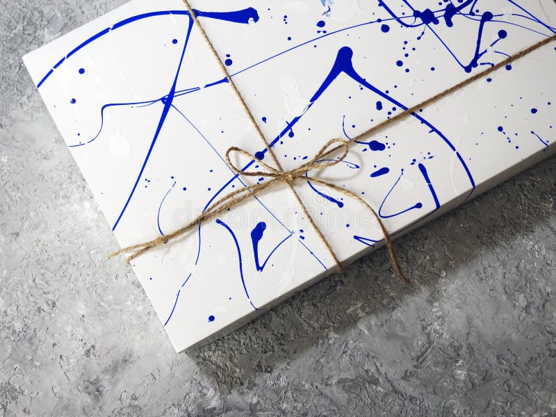 Christmas Decorative Painted Gift Box with Rope Ribbon on the Grey ...