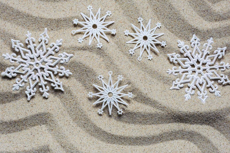 Christmas Decorative Snowflakes Lie on the Beach Sand Stock Photo ...