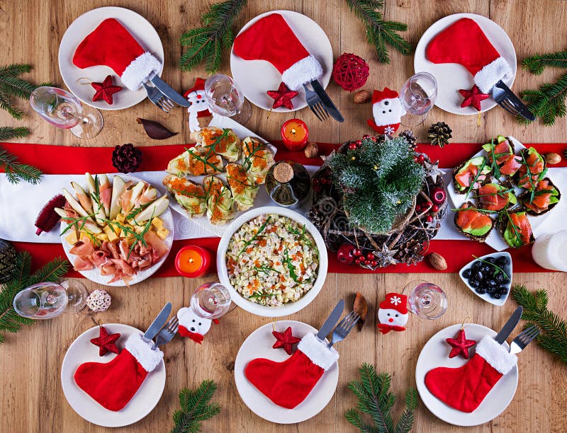 Christmas Dinner Table with Santa Hat Plates and Food Stock Photo ...
