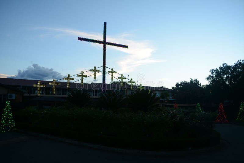 Christmas Display of Lights in Front of Cross. Stock Image - Image of ...