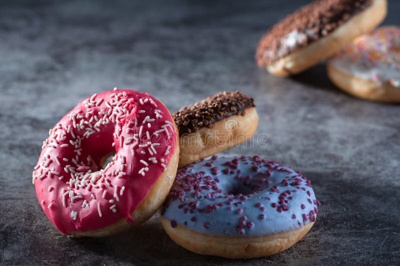 Christmas Donuts of Different Colors with Ornaments on Christmas. Stock ...