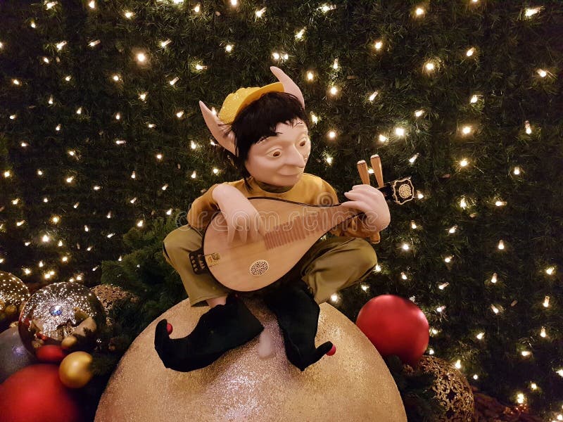 Christmas Elf on a Christmas Ball Stock Photo - Image of ball, playing ...