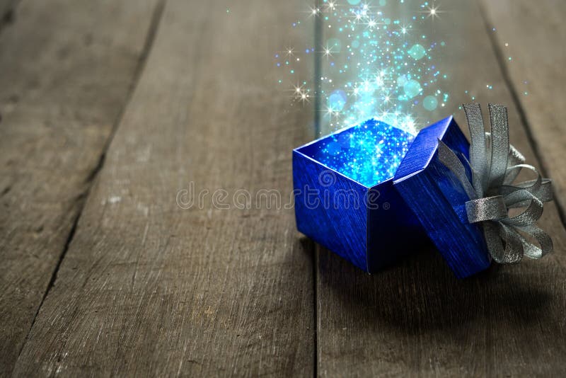 Christmas Gift Box with Blue Magical Lights Stock Photo - Image of ...