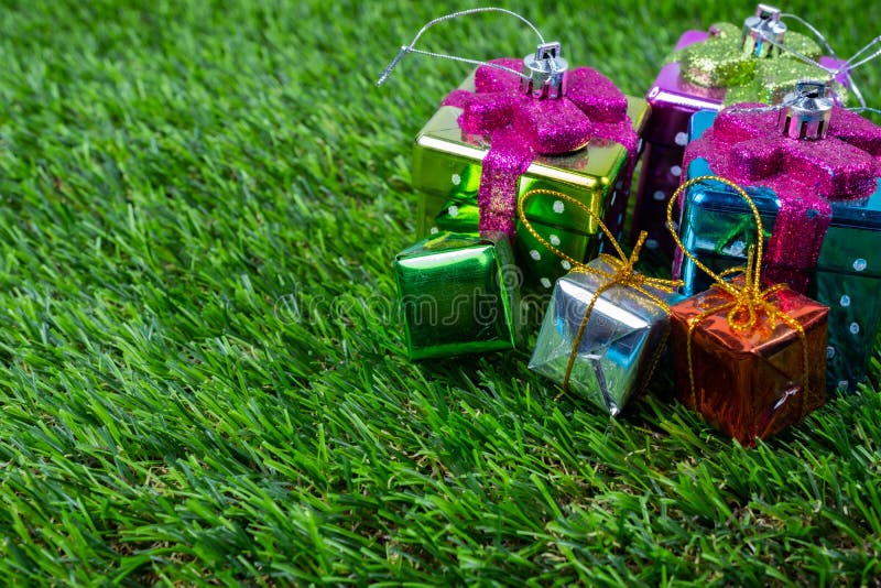 Christmas Gift Box on Grass Stock Photo - Image of ball, clew: 162988820