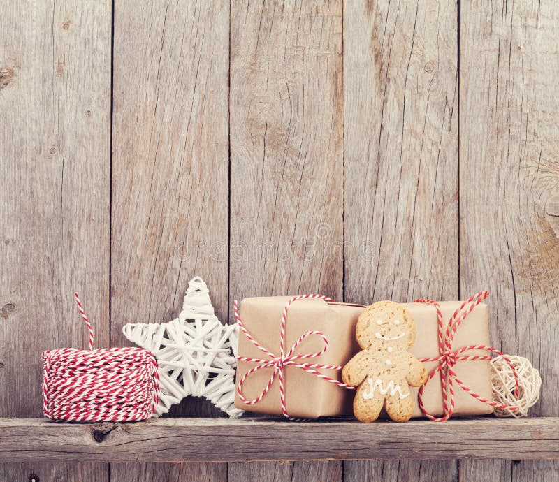 Christmas Gift Boxes and Decor in Front of Wooden Wall Stock Photo ...