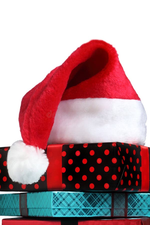 Christmas Gift and Santa Hat Stock Photo - Image of gift, isolated ...