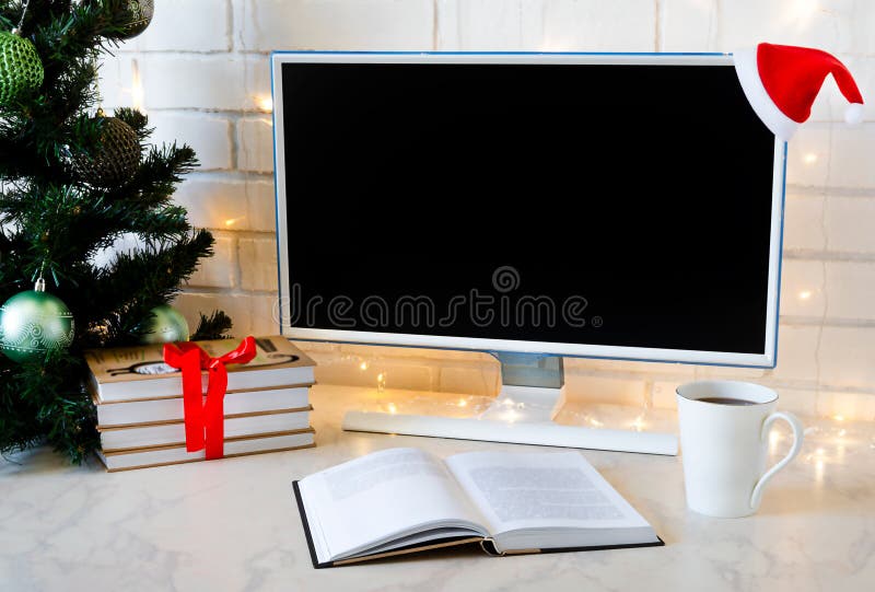 Christmas Gift Under the Tree. Desktop with Computer, Books and Coffee ...