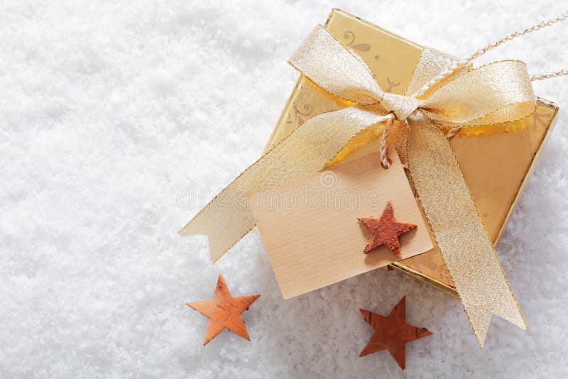 Christmas Gift in Falling Snow Stock Photo - Image of snow, christamas ...