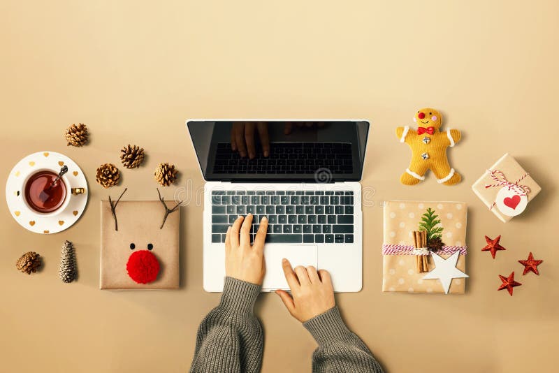 Christmas Giftboxes with Person Using a Laptop Computer Stock Photo ...
