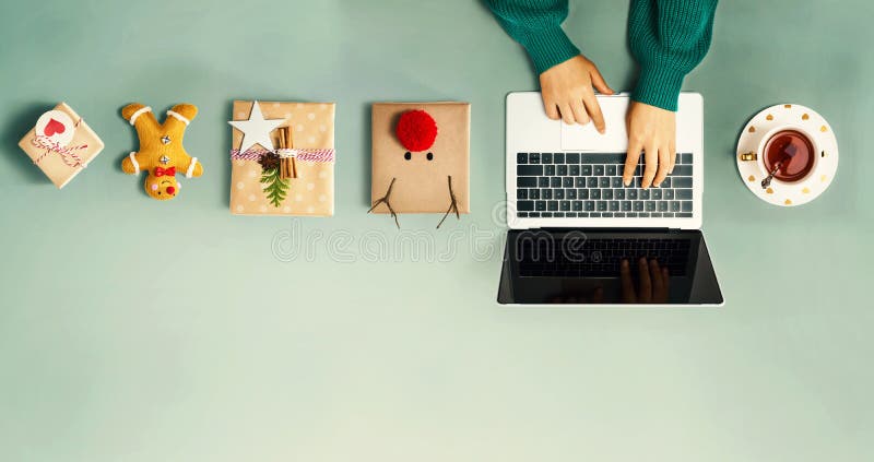 Christmas Giftboxes with Person Using a Laptop Computer Stock Image ...