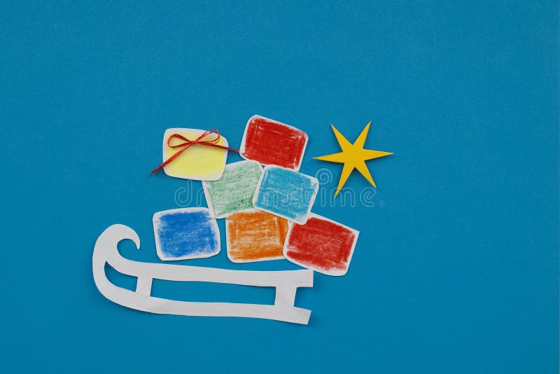 Christmas Gifts and Tree on a Sled on Blue Paper Background Stock Photo ...