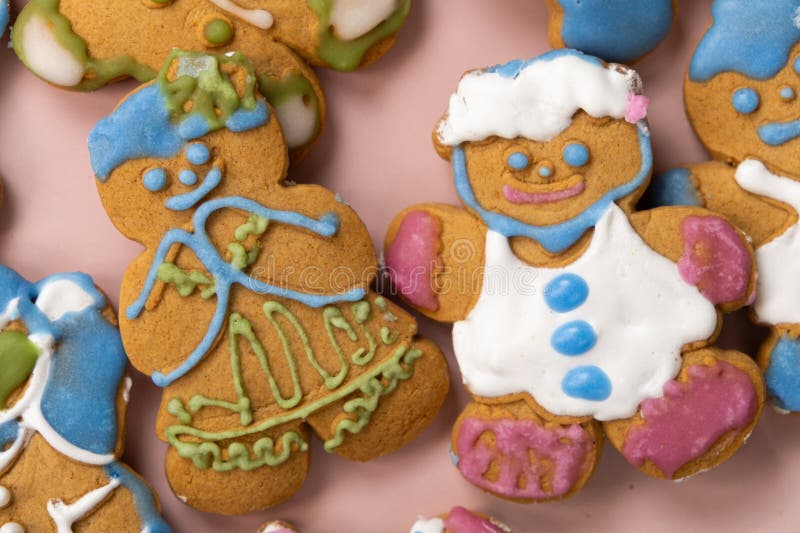 Christmas Gingerbread in the Shape of Men Decorated with Colorful Icing ...
