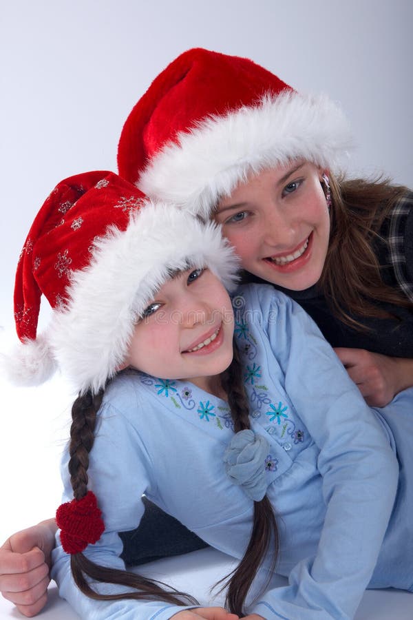 Two girls on christmas eve stock image. Image of happy - 21367849
