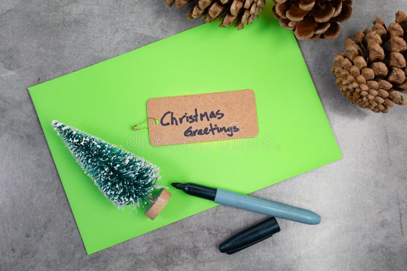 Christmas Greetings on Tag on Top of an Envelope Stock Image - Image of ...