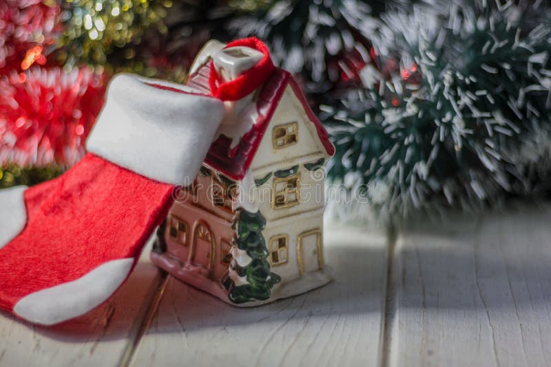 Christmas House Decorated with Big Santa Boot on Pipe. Stock Photo ...