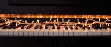 Christmas Lights on a Piano Keyboard, Front View Stock Image - Image of ...