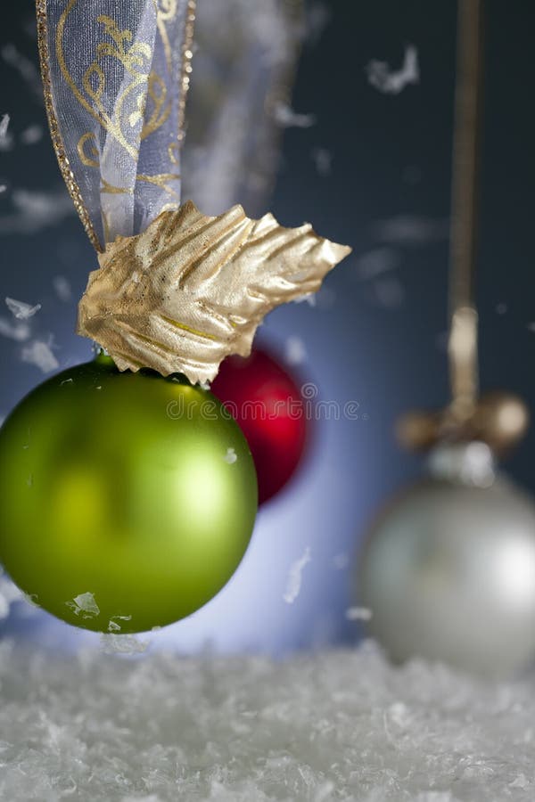Christmas Ornaments with Falling Snow Stock Image - Image of vertical ...