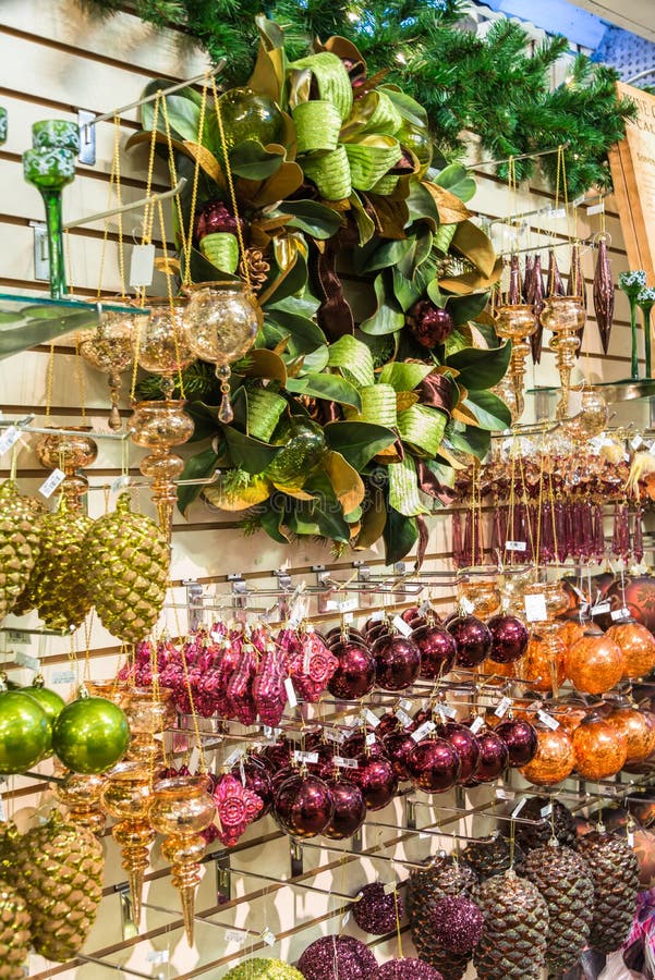 Christmas Ornaments for Sale, A rack of hanging Christmas ornaments and ...