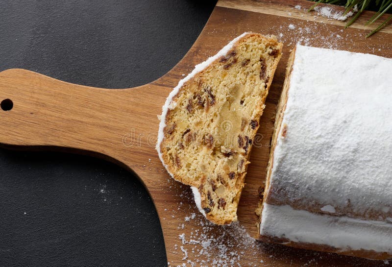 Christmas Pastries Stollen Sprinkled with Powdered Sugar on the Table ...