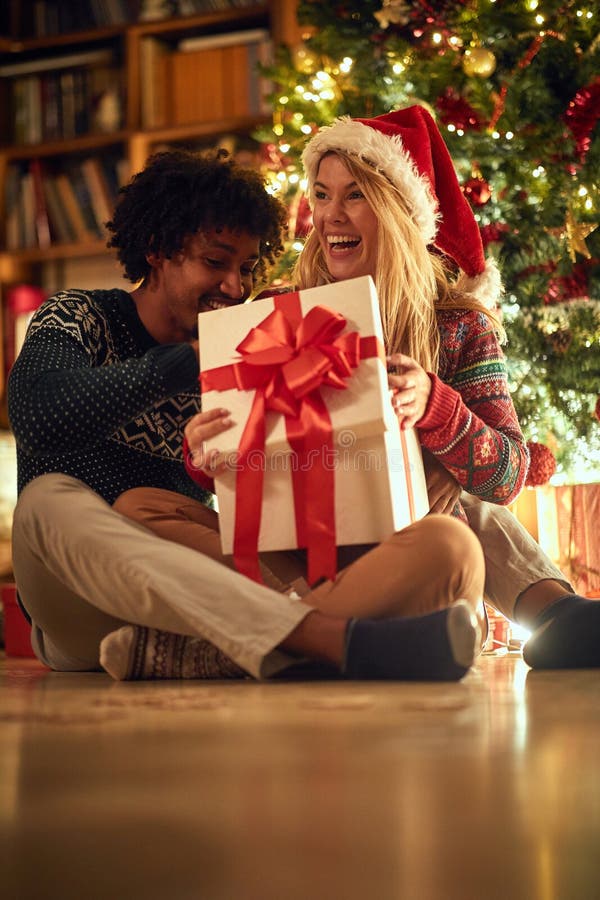 Christmas Presents. Couple Exchanging Christmas Gift Stock Image ...