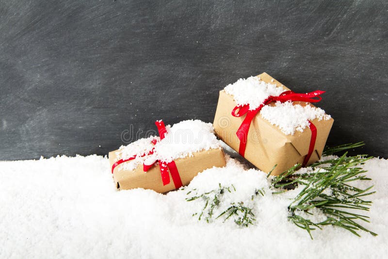 Christmas Presents in Snow Against a Blackboard Stock Photo - Image of ...