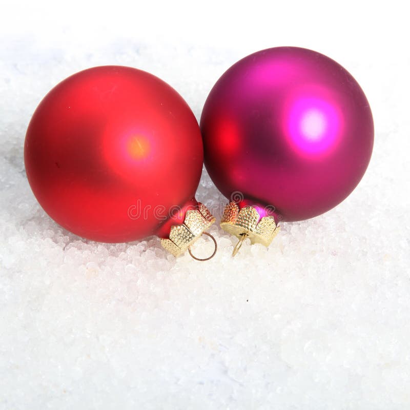 Christmas Red and Violet Globes in Snow Stock Image - Image of ball ...