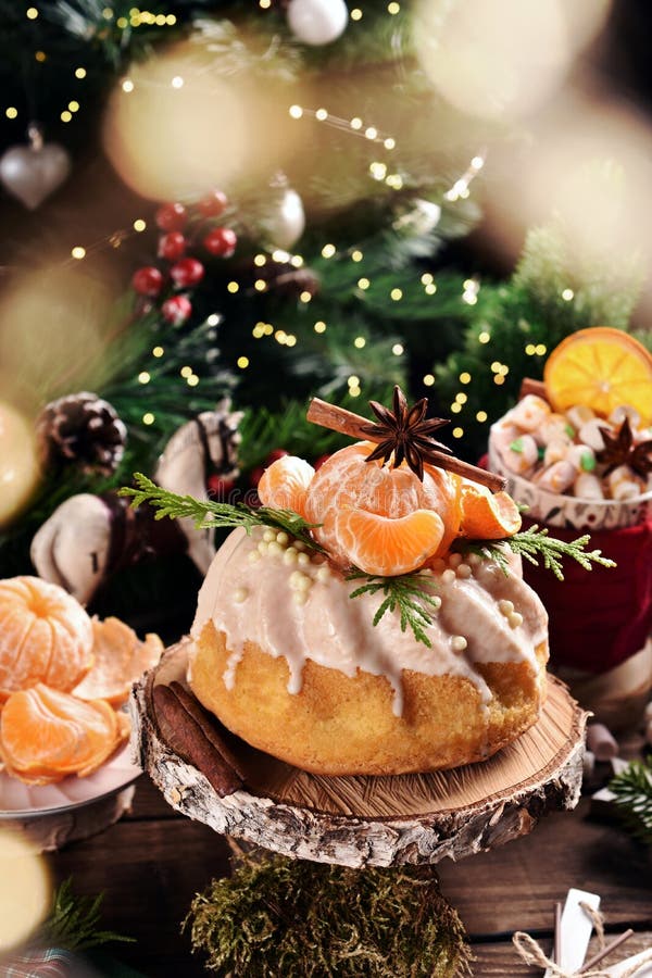 Christmas Ring Cake with Fresh Mandarin Decoration on Festive Table in ...