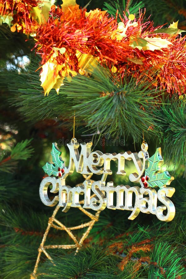 Christmas Signs Hanging on the Christmas Tree Stock Photo - Image of ...