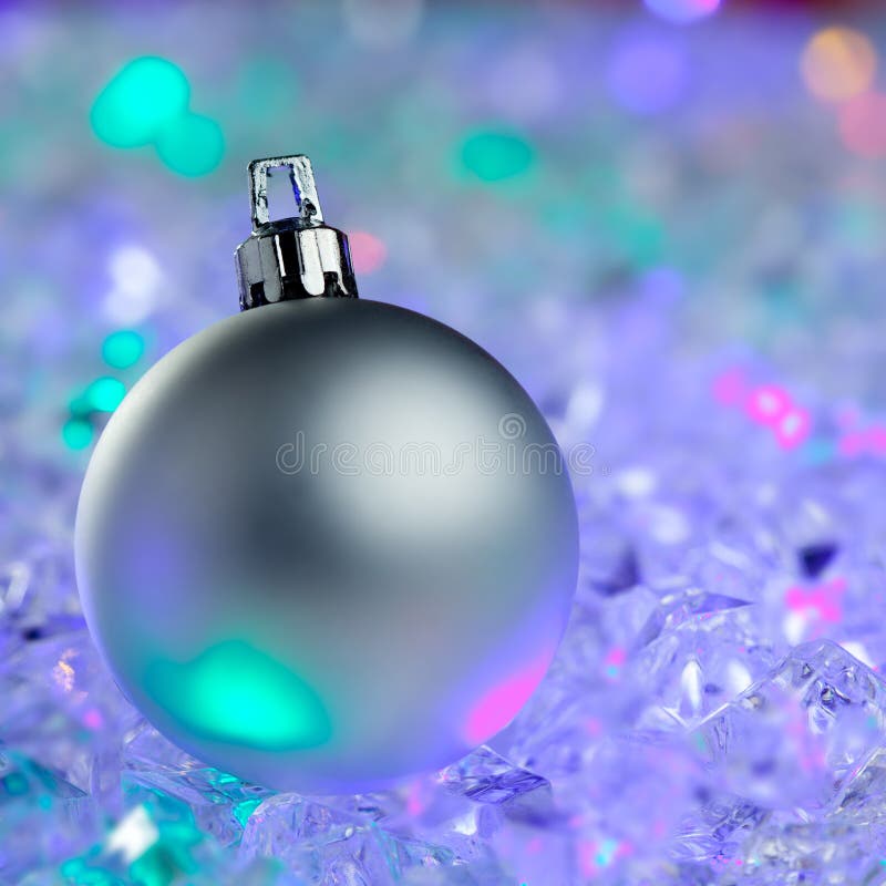Christmas Silver Bauble on Colorful Glowing Ice Stock Photo - Image of ...
