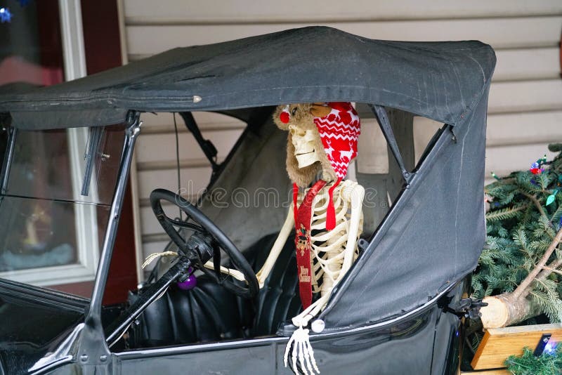 A Christmas Skeleton Driving a Car Stock Photo - Image of engine ...