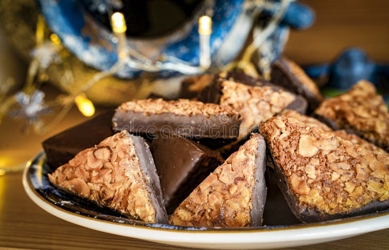 Christmas Snacks Nut Triangles and Pyramid Cake on Plate Stock Image ...