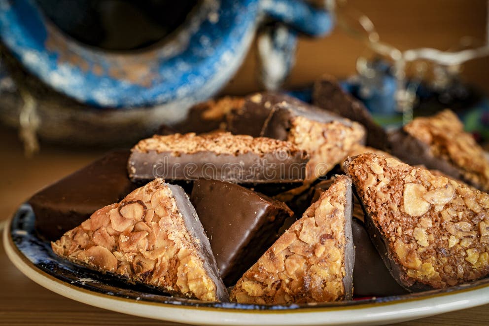 Christmas Snacks Nut Triangles and Pyramid Cake on Plate Stock Photo ...