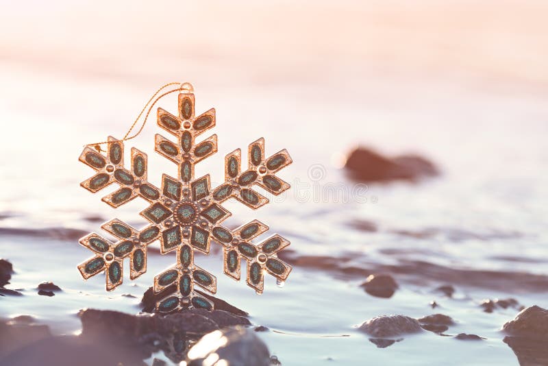 Christmas Snowflake at Sunset on the Beach Stock Photo - Image of decor ...