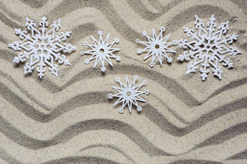 Christmas Snowflakes Lie on the Beach Sand Stock Photo - Image of ...