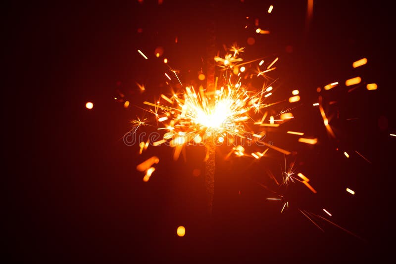 Christmas Sparkler with Red Light Stock Photo - Image of firework ...